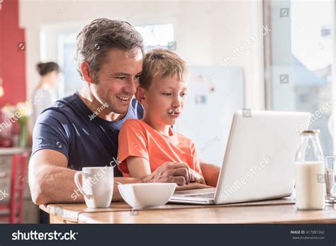 Father Son Using Laptop While Having Stock Photo Shutterstock