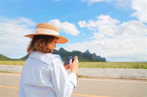Premium Photo Woman With A Vintage Camera