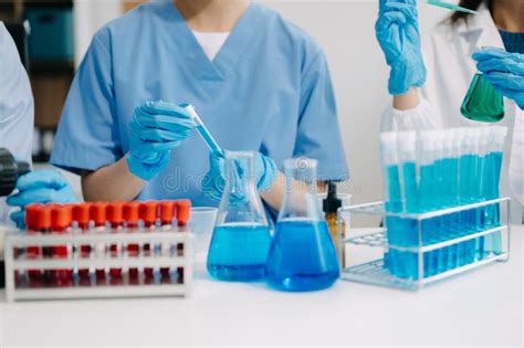 Modern Medical Research Laboratory Portrait Of Team Scientists Working Using Digital Tablet