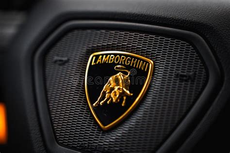 Close Up Of Lamborghini Logo On Textured Black Surface Editorial