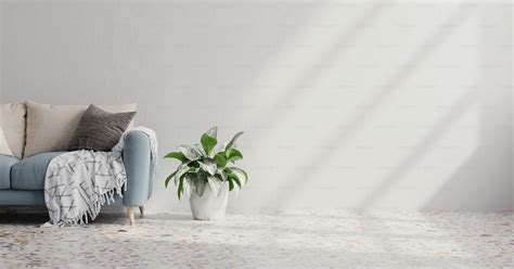 하얀 벽에 테이블이 있는 파란색 소파와 테라조 바닥3d 렌더링 사진 Unsplash의 아파트 이미지