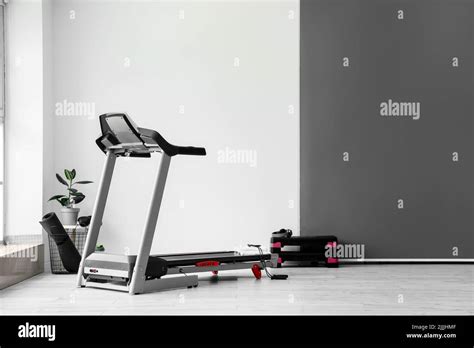 Modern Treadmill With Towels And Skipping Room In Gym Stock Photo Alamy