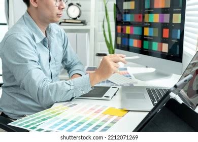 Male Graphic Designer Choosing Color Swatch Stock Photo Shutterstock