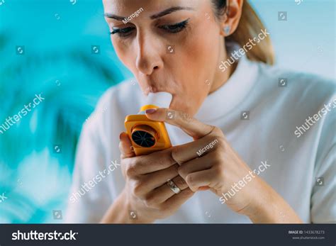 17 Woman Using Spirometer Measuring Lung Capacity Force Expiratory