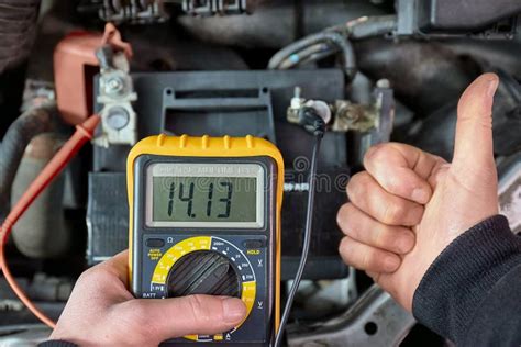 Checking Car Battery And Alternator Voltage With Running Engine Stock Image Image Of Attach