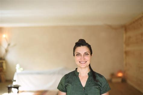 Premium Photo Portrait Of Smiling Female Masseuse In Therapy Salon