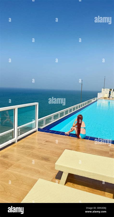Solo Female Travel Freedom At Oceanfront Infinity Pool Confident