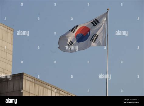 Flag Of South Korea Waving White Flag With Red And Blue Center And