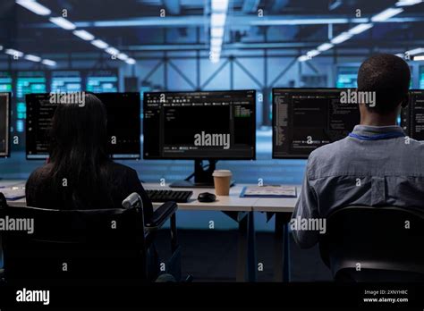 Person With Disability And Coworker In Inclusive Server Room Facility