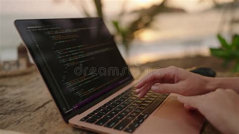 Female Developer Working On Laptop Creating Apps By The Ocean Young