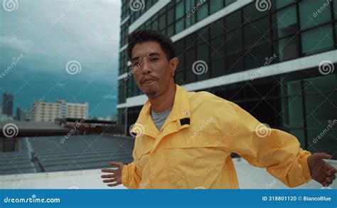 Dancer Pose At Camera While Standing At Rooftop Low Angle Camera