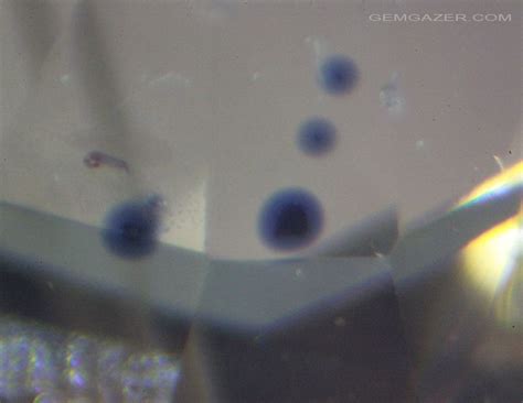 A Beryllium Diffusion Treated Orange Sapphire With Tell Tale Fuzzy Blue