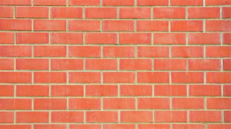 Оранжевая старинная кирпичная стена фон