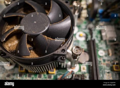 A Very Dirty Computer Fan Inside A Computer Is Cleaned By A Vacuum Cleaner Stock Photo Alamy
