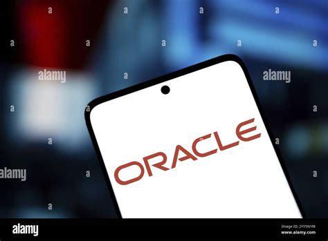 Oracle Logo Is Diaplayed On Smartphone Oracle Corporation Is An