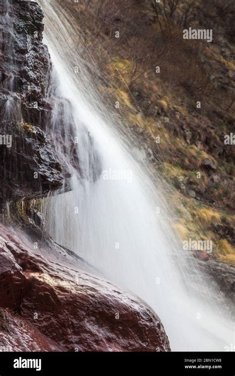 Stunning Close Up Details Of Powerful Waterfall Cascading Down The Red