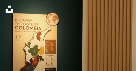 벽에 포스터가 붙어있는 방의 테이블과 의자 사진 Unsplash의 무료 실내 이미지