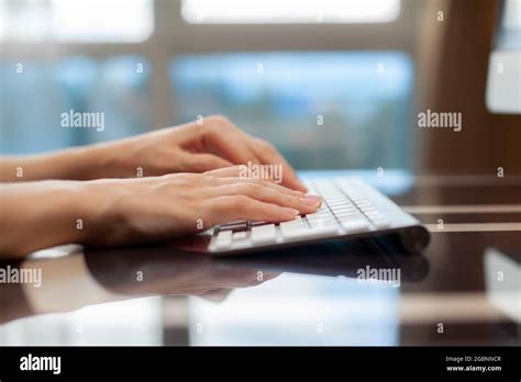 Female Hands Typing Text On The Keyboard While Exchanging Messages With Friends Via Social