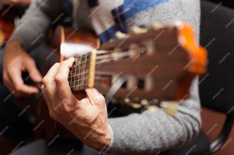 Premium Photo Detail Of A Classical Guitar Player