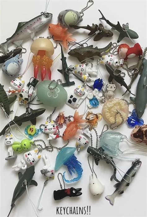 There Are Many Different Types Of Keychains On This White Surface With