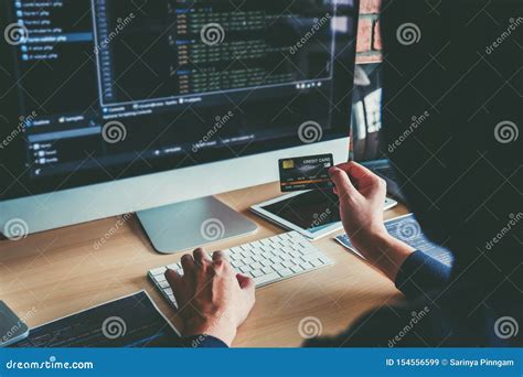 Hooded Hacker With Mask Typing On Virtual Keyboard Stock Image