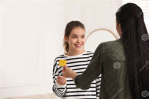 Mother Giving Condom To Her Teenage Daughter At Home Sex Education