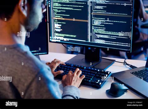Indian Software Development Working On Coding Computer Screen And Flowchart At Night In Modern