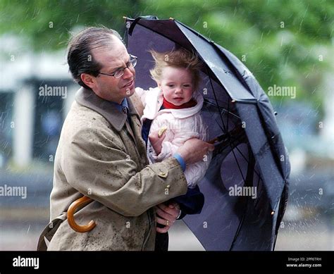 Larry Ehrhardt Of Boston Protects His Daughter Ruth 2 From The Weather While Walking In Boston