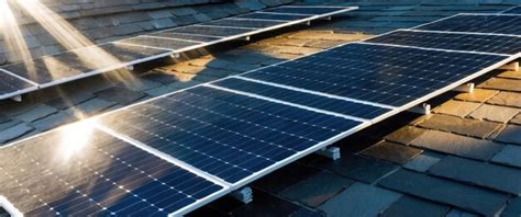 a close up of a solar panel array capturing sunlight on a rooftop