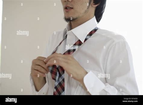 Man Adjusting His Tie Stock Photo Alamy