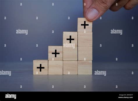 Hand Put Wooden Cube With Plus Sign Added Value Positive Mindset Emerging Market And