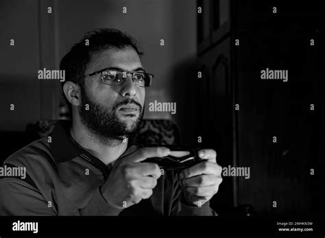 Arabic Guy Playing Console Games Alone Stock Photo Alamy