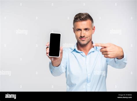 Handsome Adult Man Pointing At Blank Screen Of Smartphone Isolated On White Stock Photo Alamy