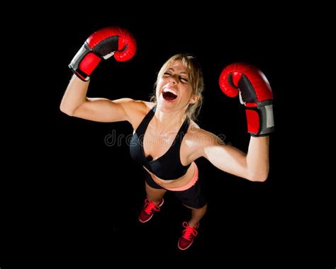 Young Happy Beautiful Boxer Girl With Boxing Gloves Arms In Victory