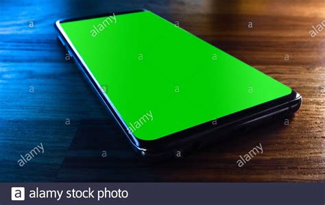 Close Up Macro Modern Green Mock Up Screen Smartphone Lying On Desk