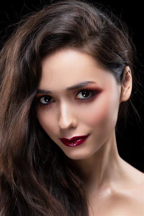 Portrait Of A Beautiful Glamorous Brunette Girl With Naked Shoulders Shimmering Makeup Red