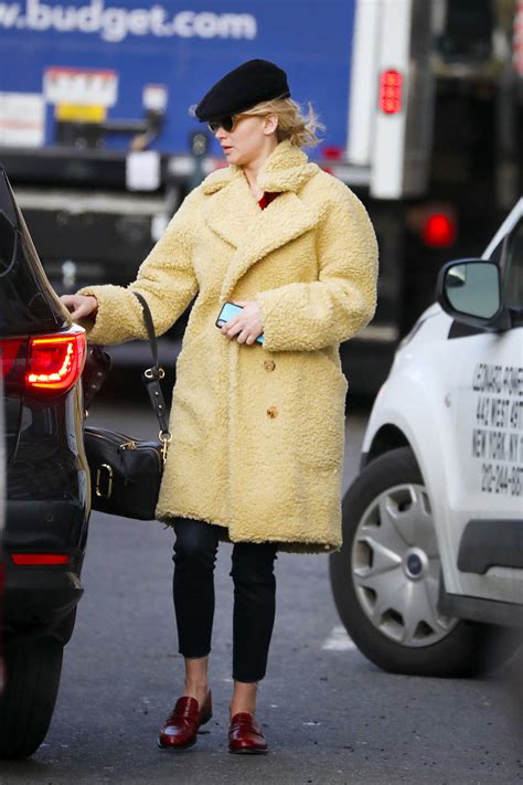 Jennifer Lawrence In A Yellow Fur Coat Does Some Christmas Shopping In