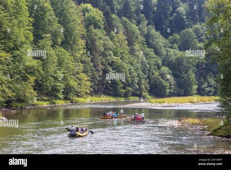 Rubber Raft And Wooden Boats With Tourists On The Dunajec River In