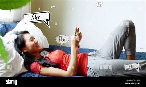 Image Of Social Media Text In Speech Bubbles Over Asian Woman Using