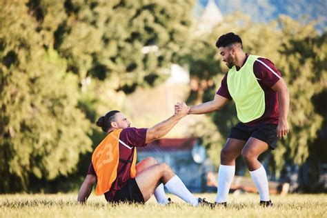 Premium Photo Rugby Teamwork And A Sports Man Helping A Friend While