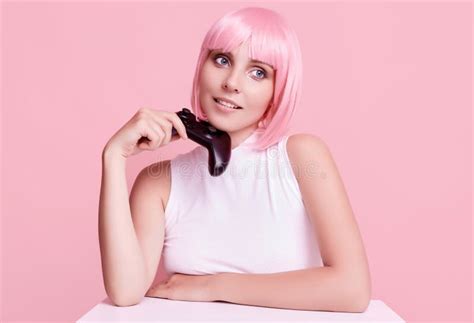 Happy Gamer Girl With Pink Hair Playing Video Games Using Joystick