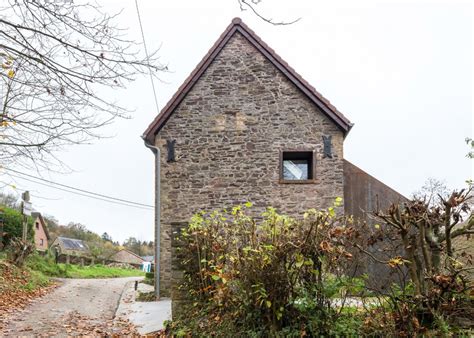 Puzzles Architecture Adds Rusted Steel Extension To Belgian Barn
