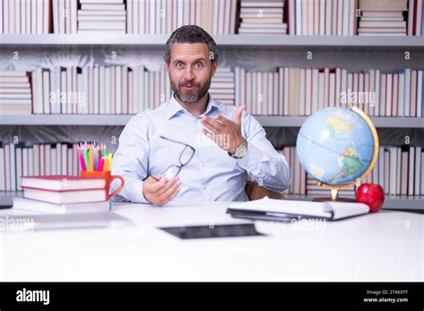 Teachers Day Teacher In School Classroom Knowledge And Education With Middle Aged Teacher