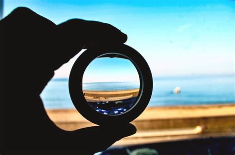 Premium Photo Close Up Of Person Holding Magnifying Glass
