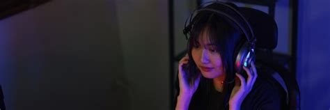 Premium Photo Female Cyber Hacker Gamer In Headphone Watching Video