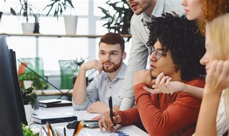 Diverse Team Of Professionals Engaged In Collaborative Project