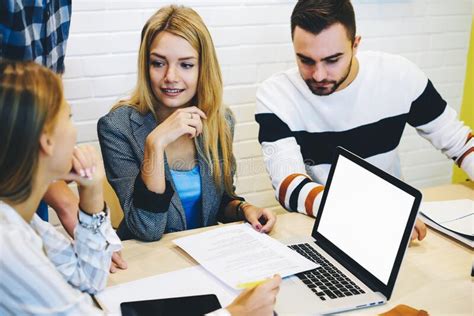 Young It Programmers Collaborating On Creating Application Using