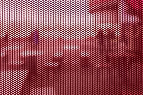 Premium Photo Abstract Red Perforated Pattern