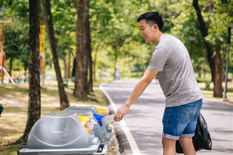 Babe Man Throwing Trash Into Bin Containing Plastic Asian And Man Save Earth Trash Stock