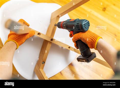 Assemble Furniture Man Assembling Chair Furniture Assembler With